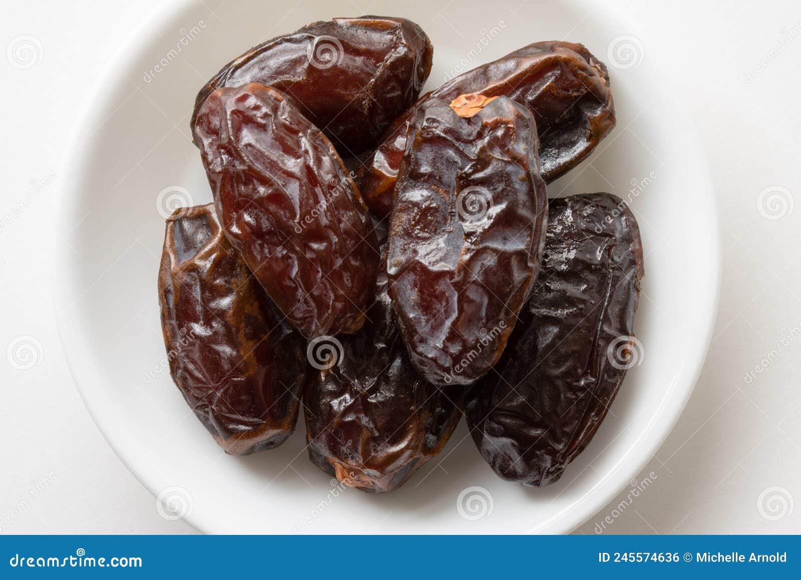 Dates Isolated in a Bowl stock photo. Image of background - 245574636