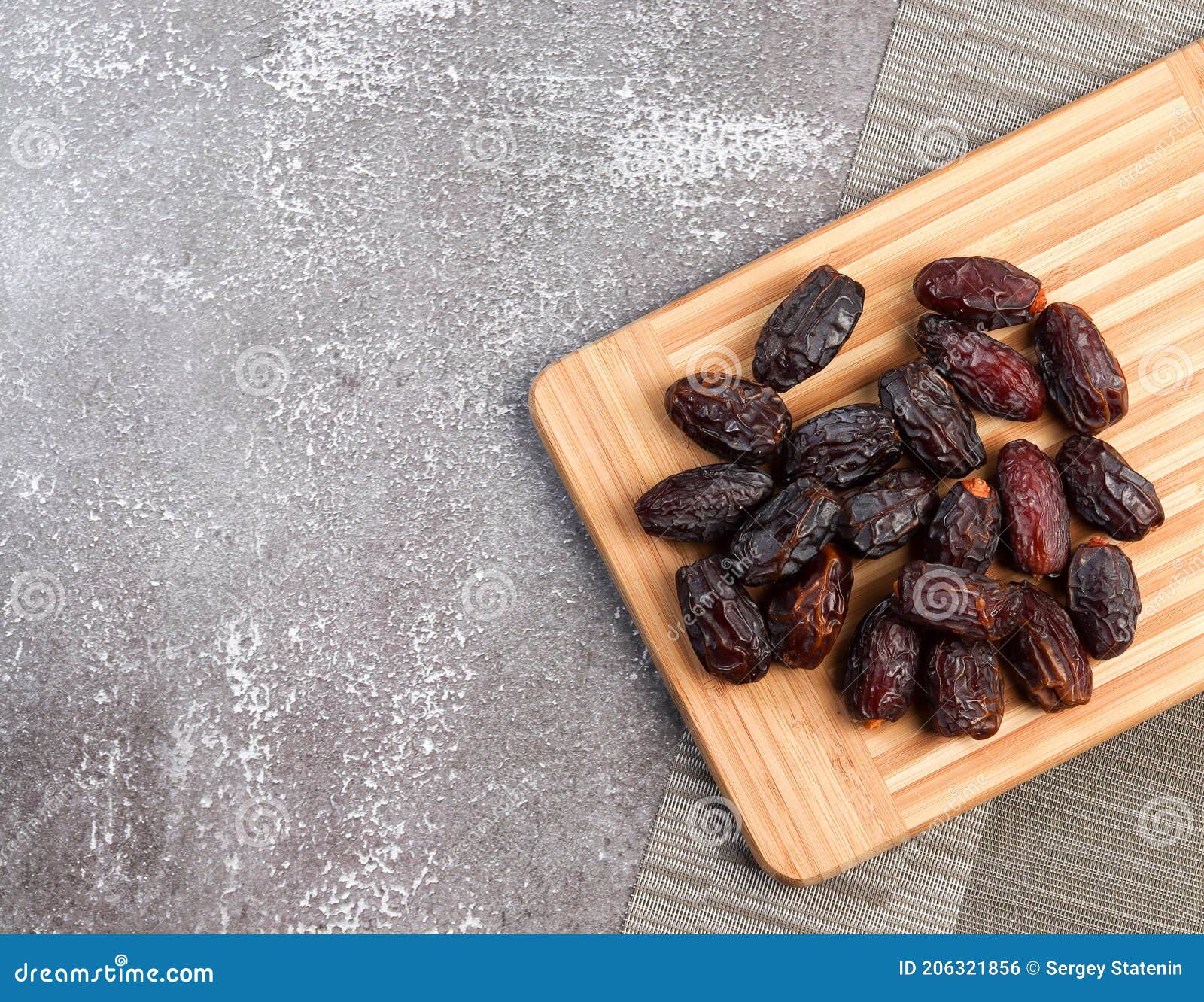 Dates on a Rectangular Cutting Wooden Board on a Dark Background Stock ...