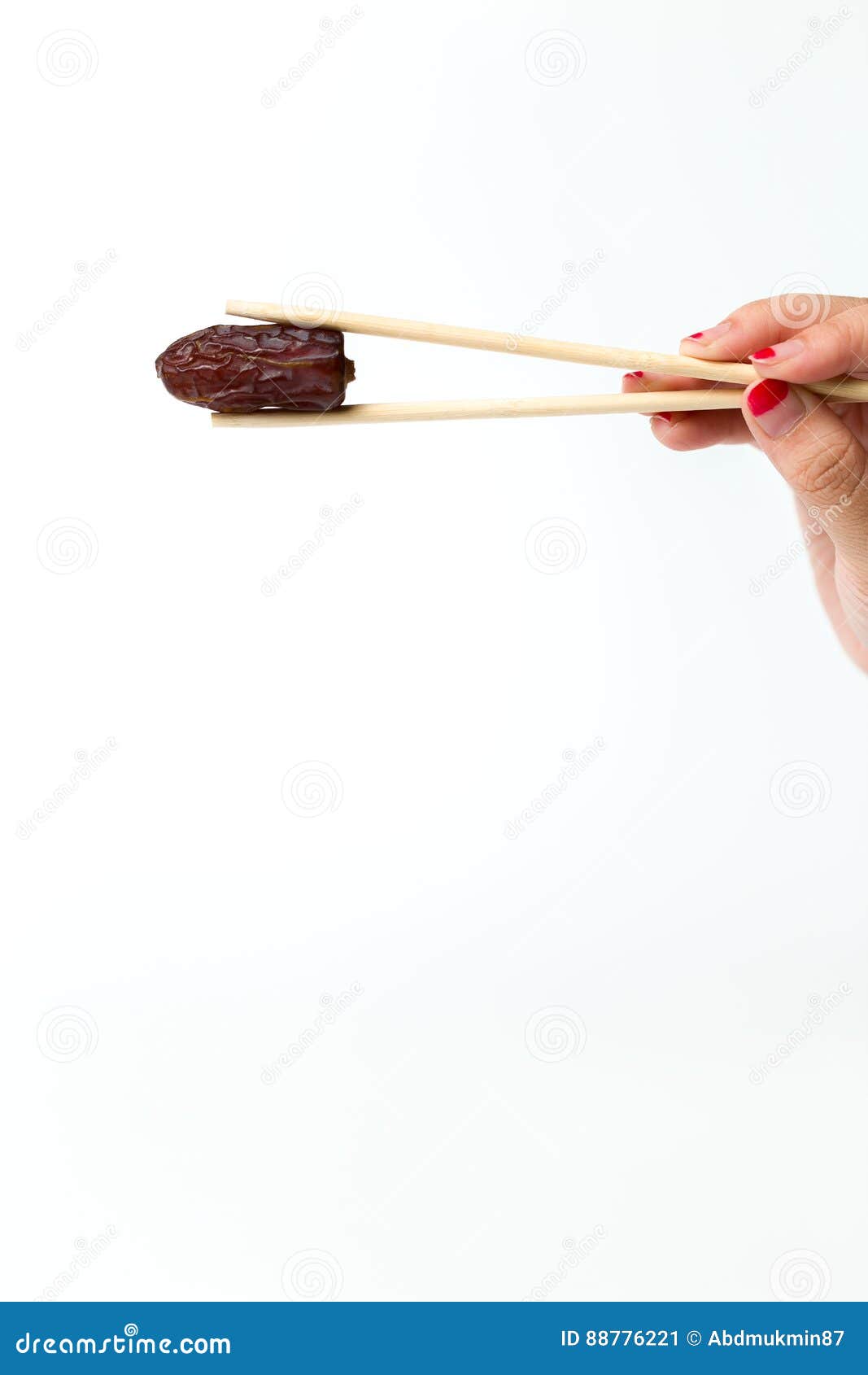A Dates by a Woman Finger Using a Chop Sticks Stock Image - Image of ...