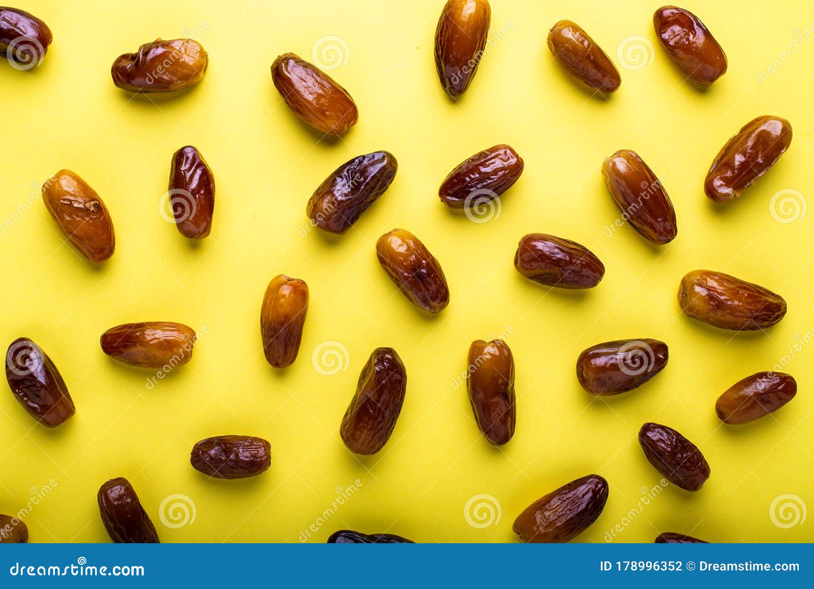 Dates on a Yellow Background Stock Photo - Image of brown, group: 178996352