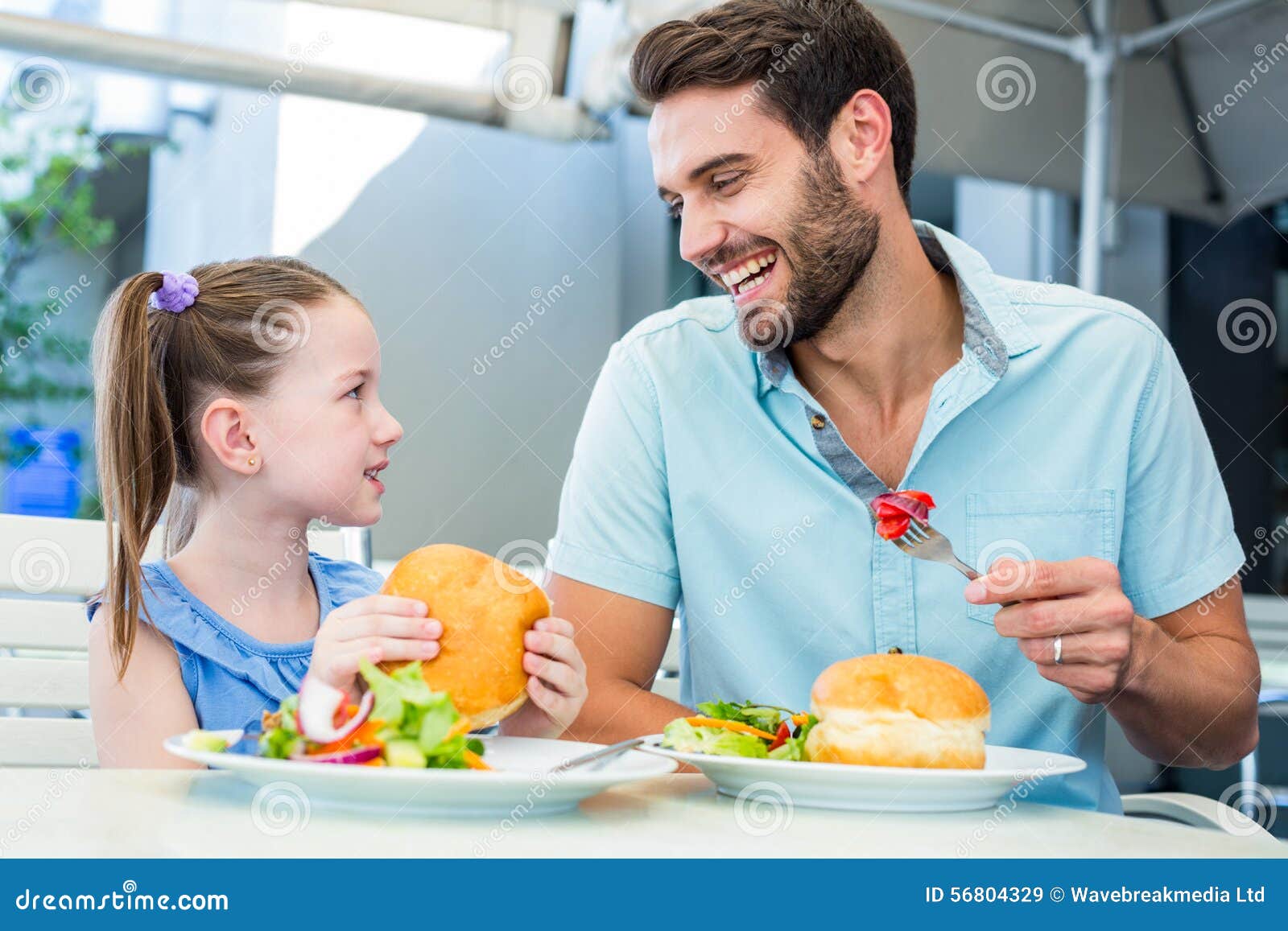 Daughter and Father Eating at the Restaurant Stock Image - Image of ...