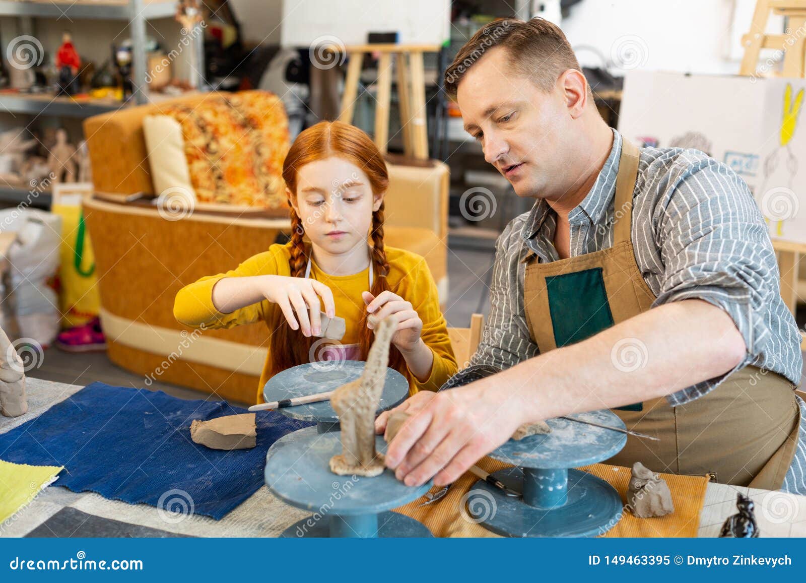 Daughter and Father Modeling Clay Animals in Workshop Stock Image ...