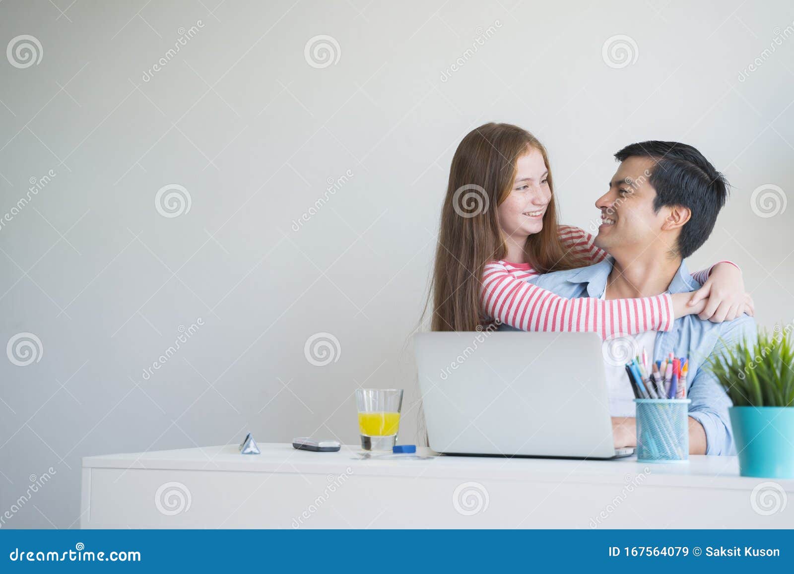 The Daughter Gives Her Father the Power To Work. Stock Image - Image of ...