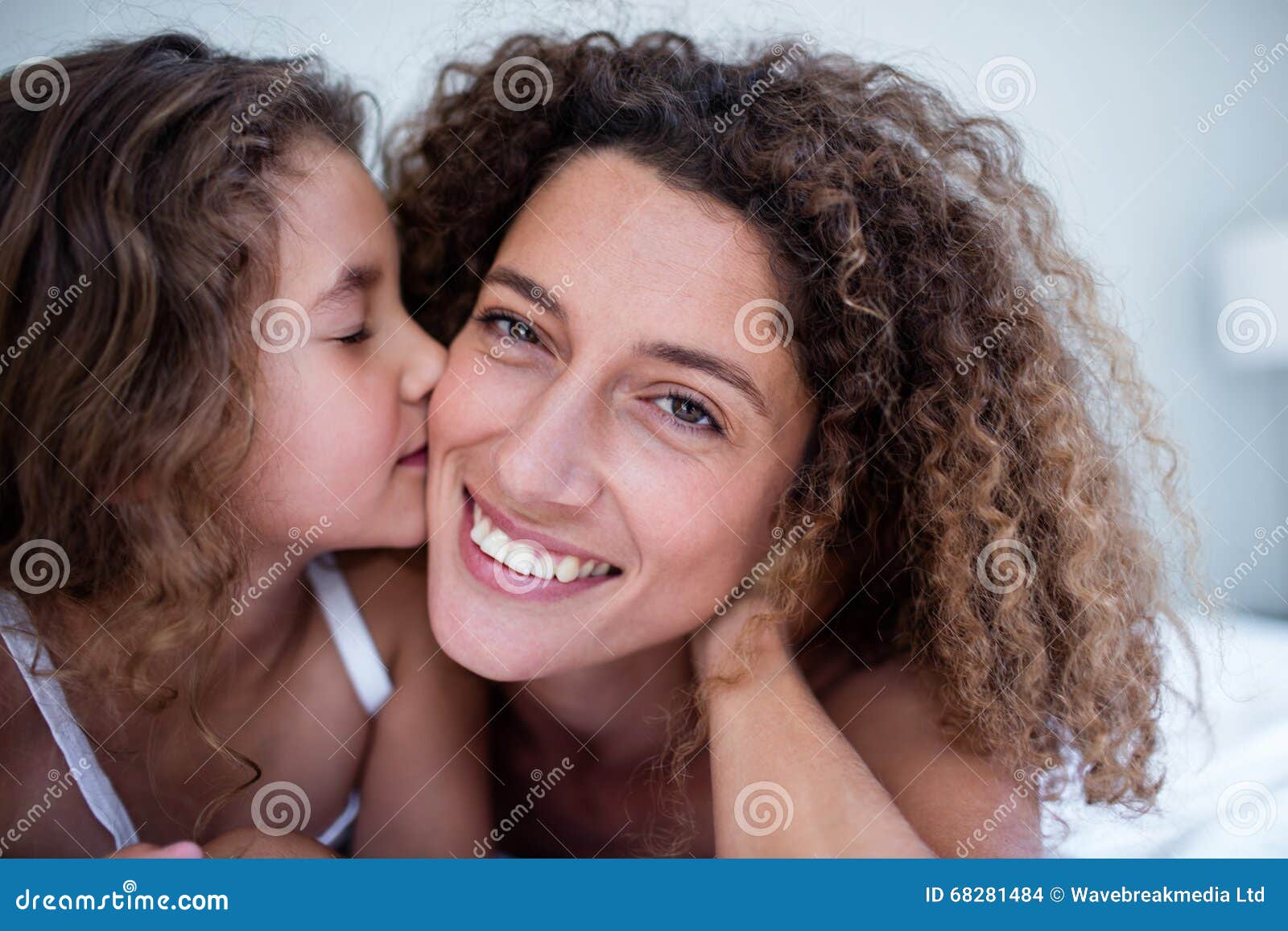 Daughter Kissing Her Mother on the Cheek Stock Photo - Image of ...