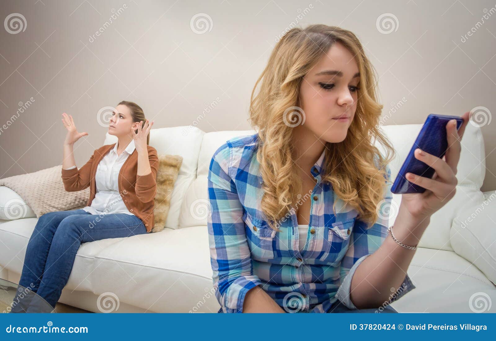 Daughter Looking a Phone and Ignoring Her Mother Stock Photo - Image of ...