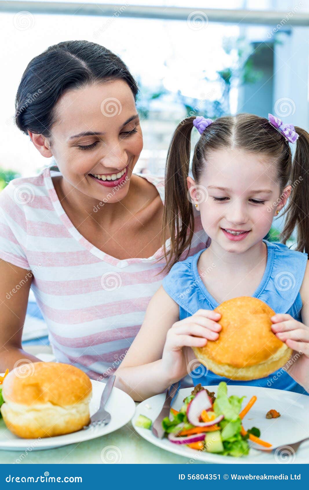Daughter and Mother Eating at the Restaurant Stock Image - Image of ...