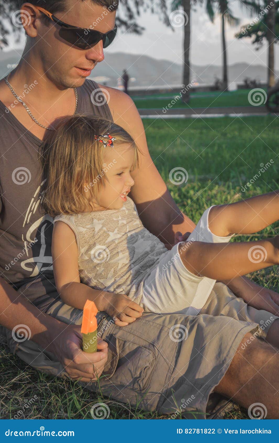 Daughter Sitting on the Lap of Dads Stock Photo - Image of care ...