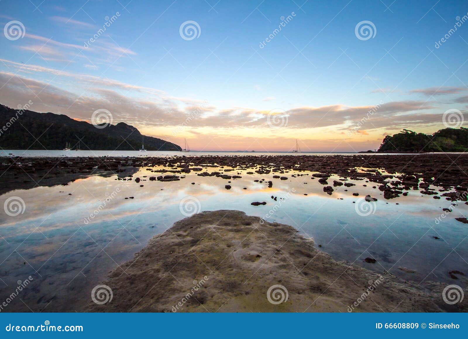 Dawn at Datai Beach stock image. Image of serene, boats - 66608809