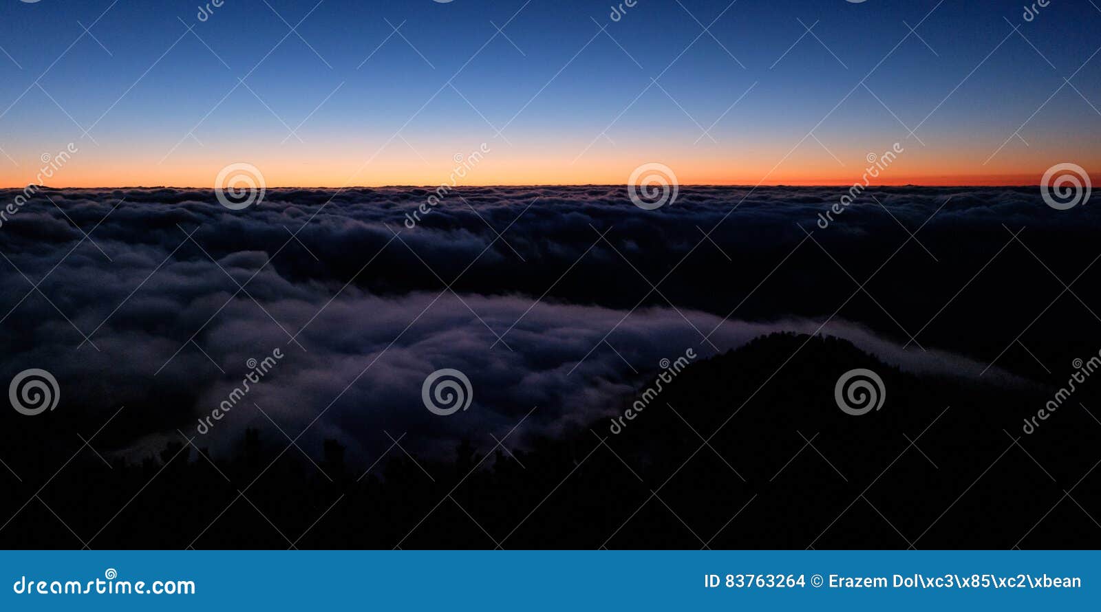 Dawn Sky Gradient with a Sea of Clouds Below Stock Photo - Image of ...