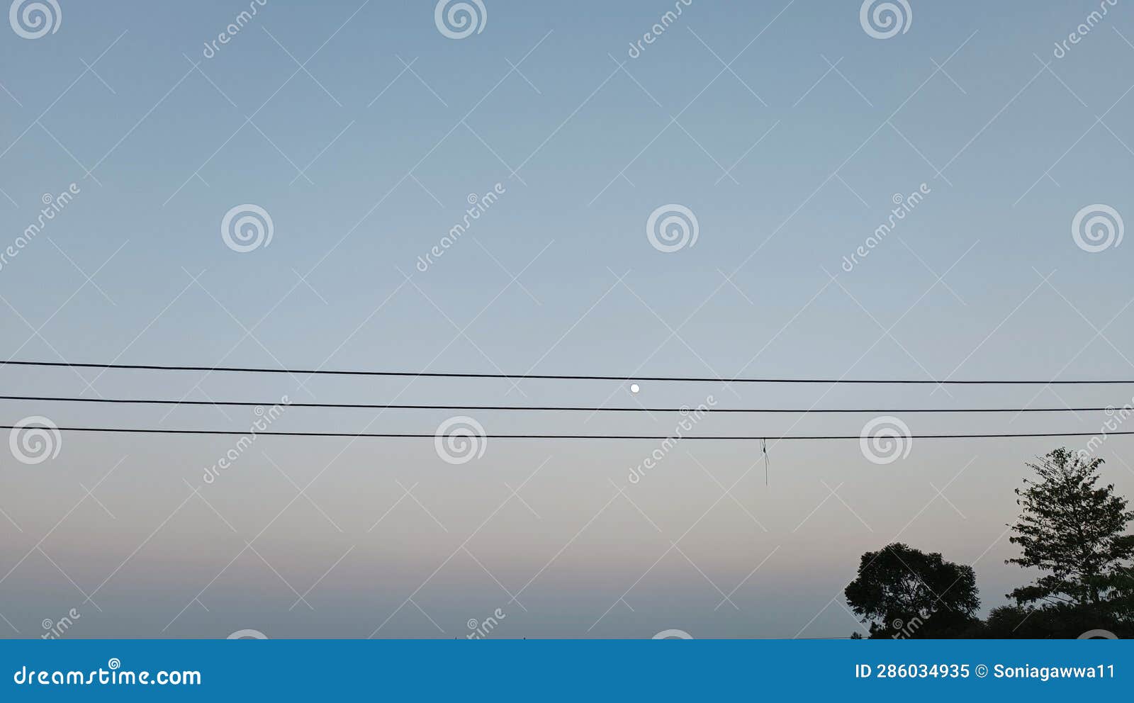 The Dawn Sky with Moonlight and Stretched Electrical Cables Stock Image ...