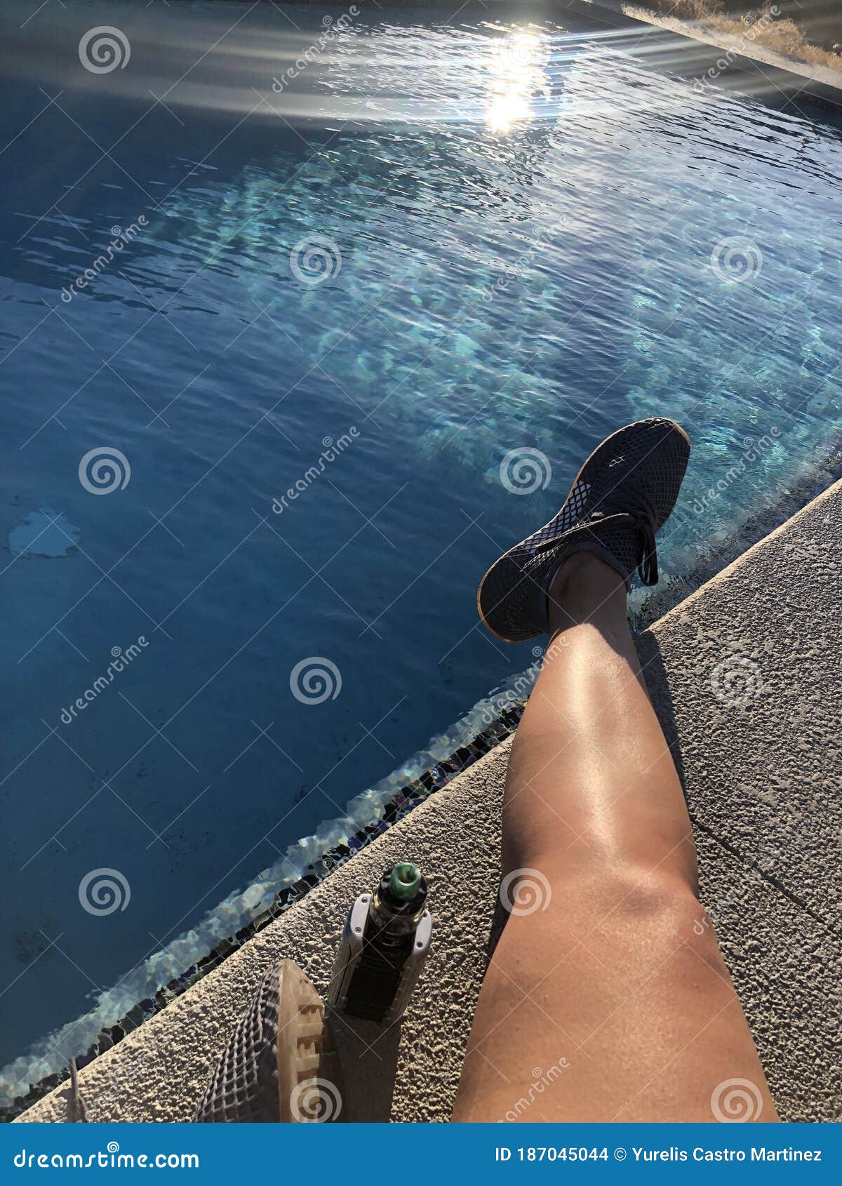 Day by the pool stock photo. Image of pool, legs, shine - 187045044