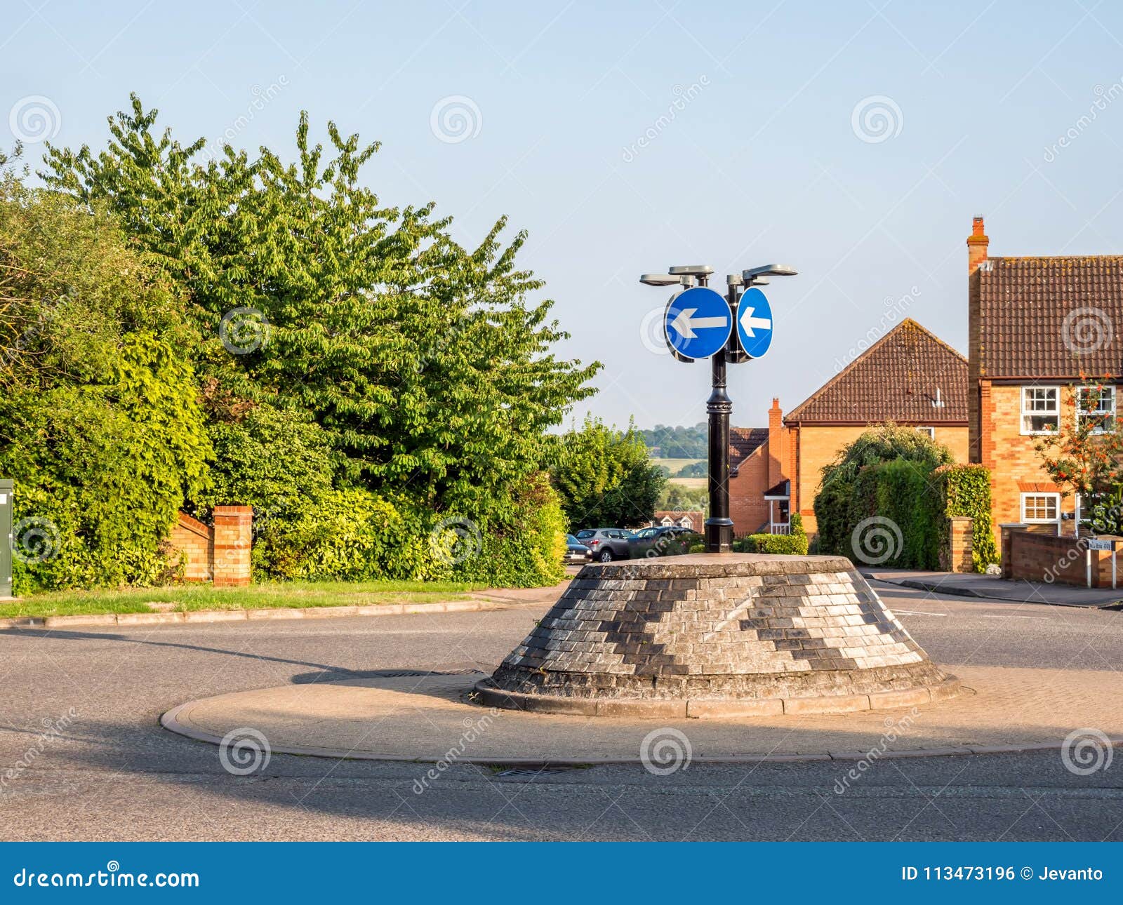 Day View of Typical English Brick Roundabout with Directional Signs ...
