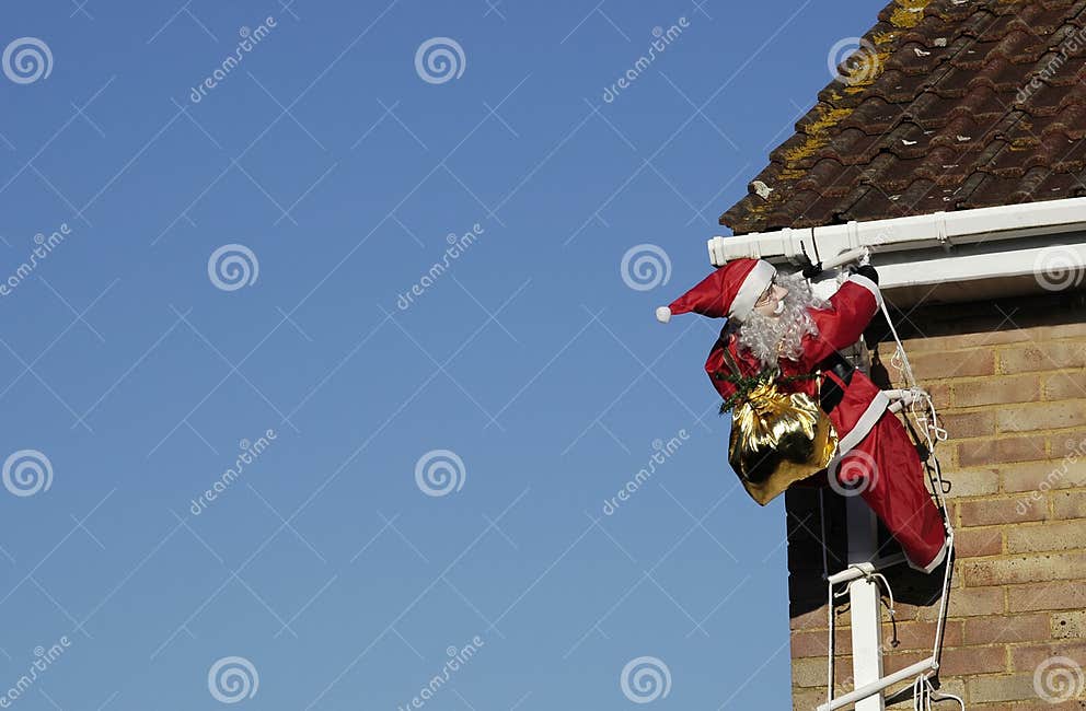 Daylight Santa stock image. Image of guttering, climb, christmas - 496869