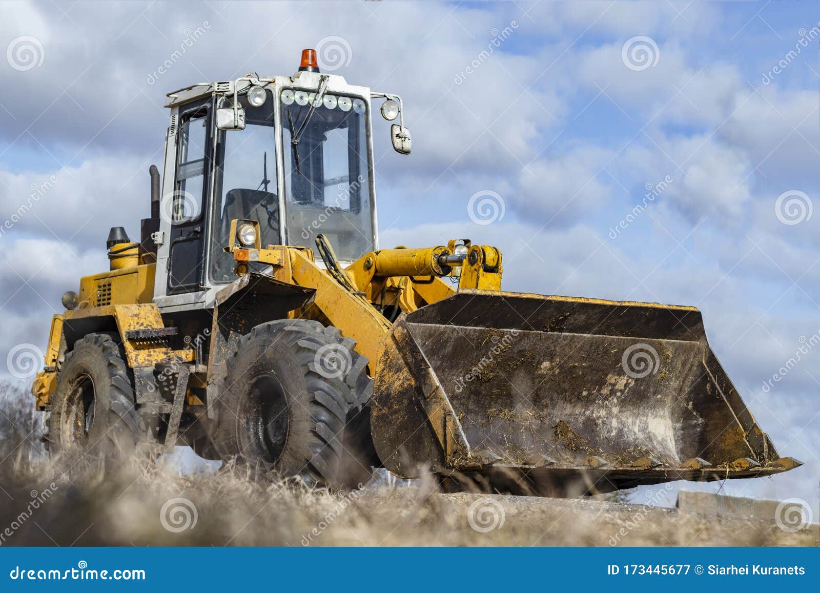 Daylight Yellow Loader with a Bucket. There is a Tint Stock Image ...