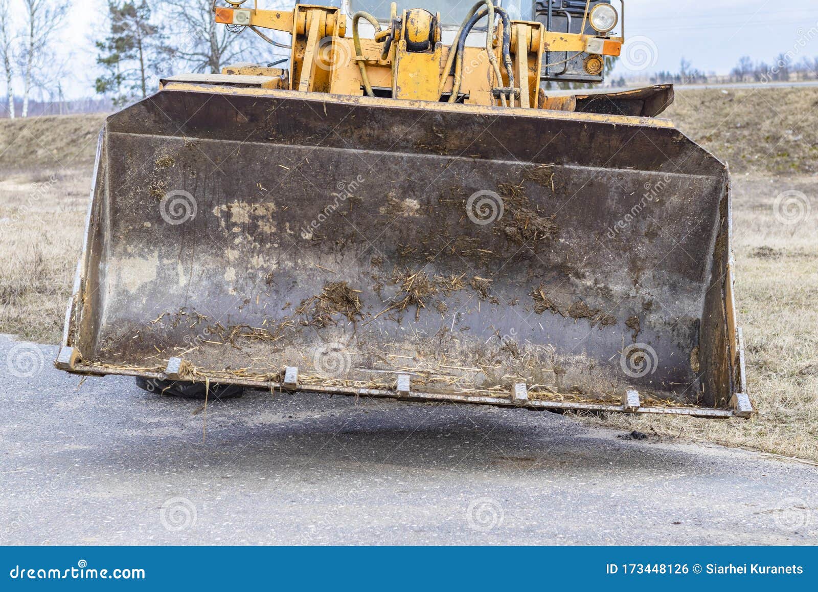 Daylight Yellow Loader with a Bucket. There is a Tint Stock Photo ...
