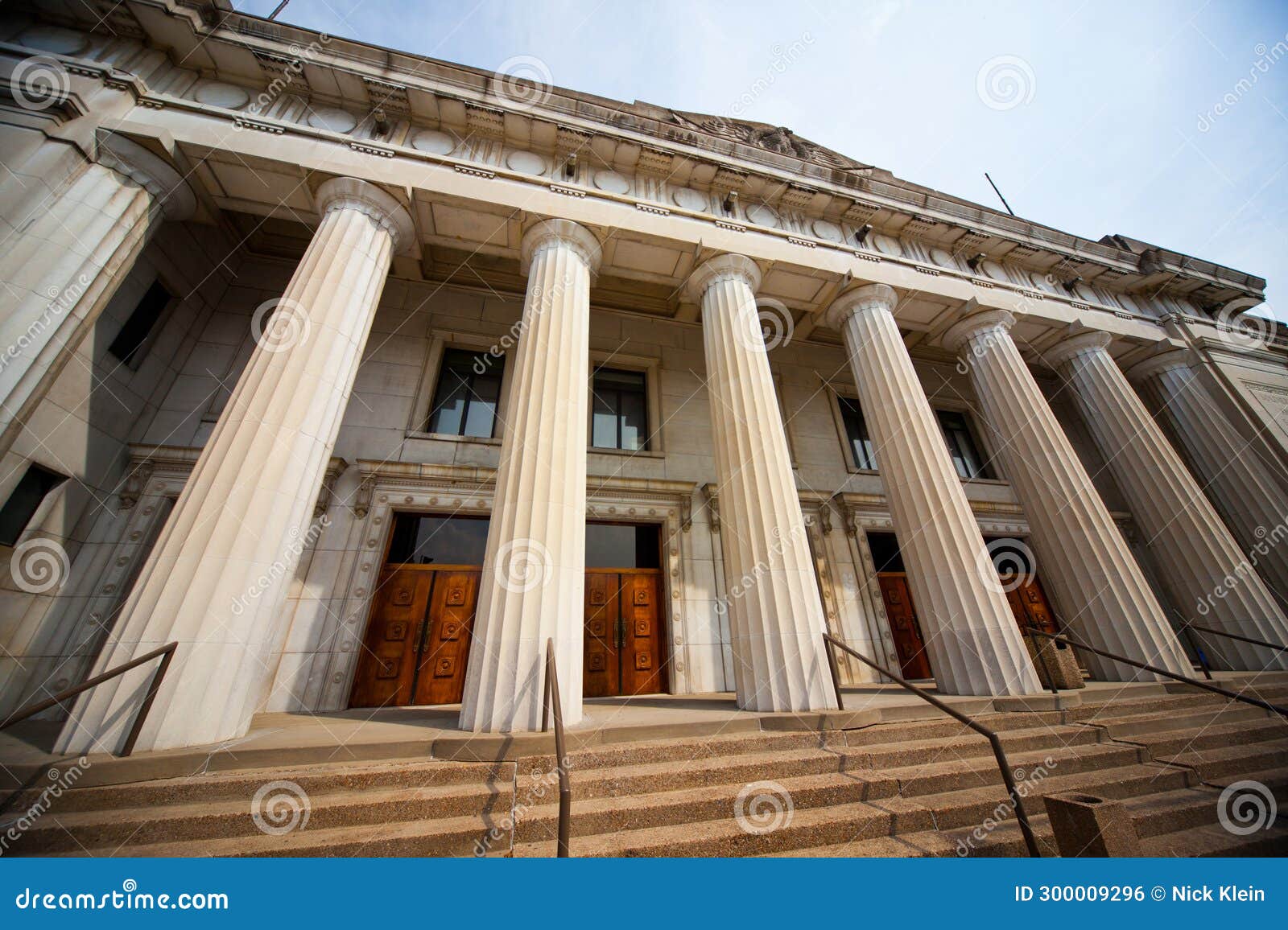 Daytime View of Neoclassical Building with Tall Columns and Stone Steps ...