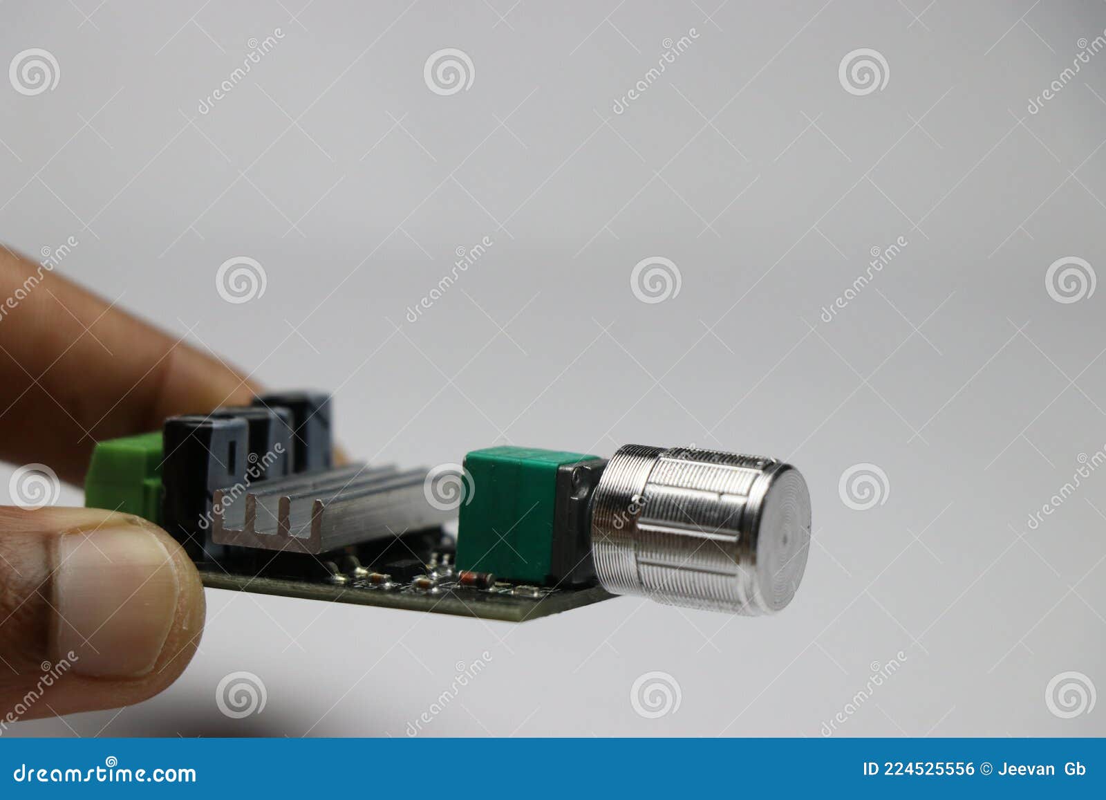 DC Motor Speed Controller Held in Hand on White Stock Photo - Image of ...