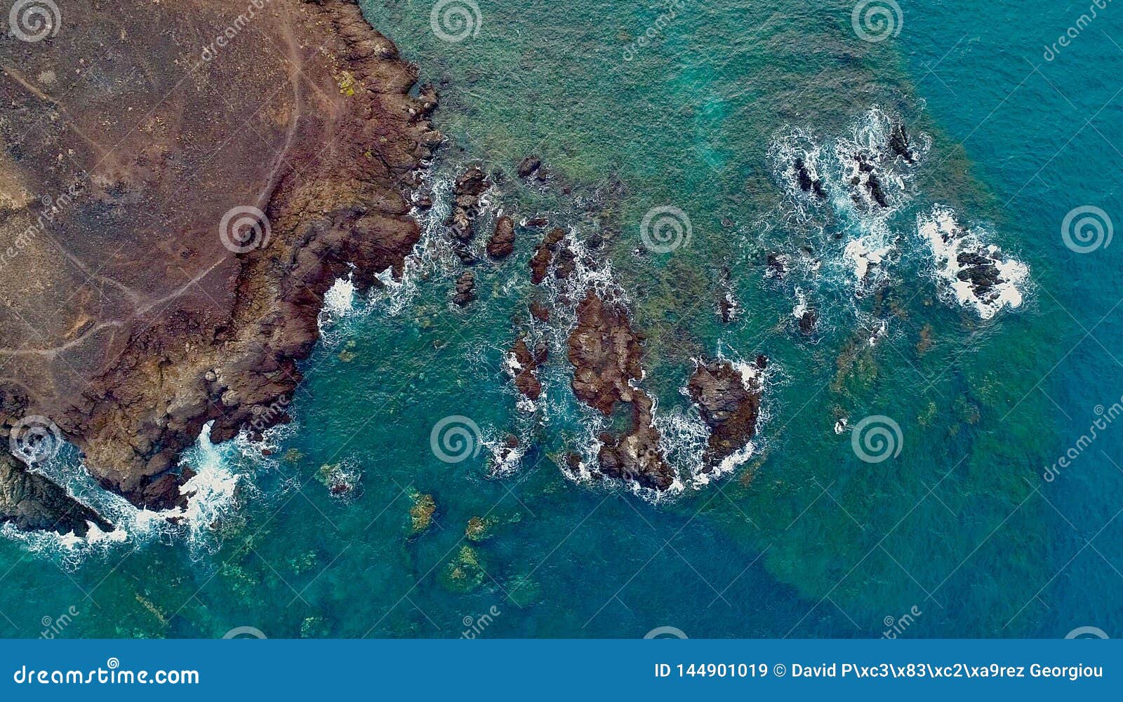 Rocks left behind stock image. Image of ocean, lava - 144901019