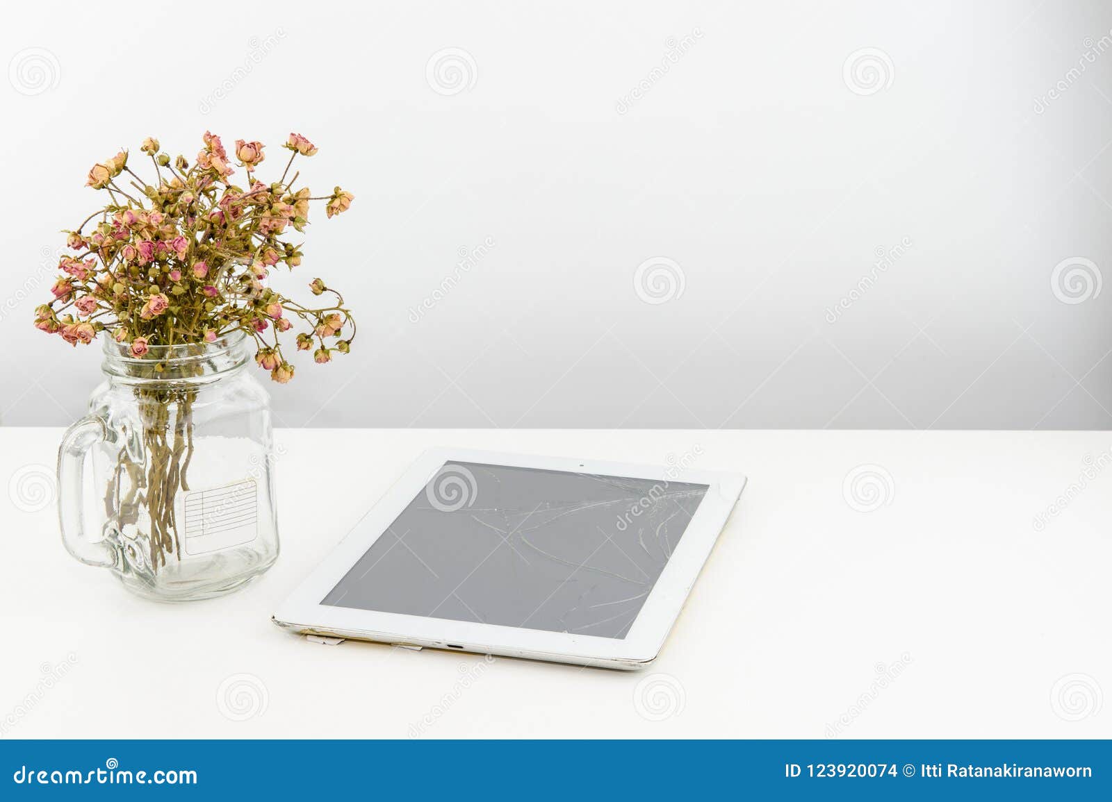 Tablet Screen Break with Dead Flower in Vase. Stock Photo - Image of ...