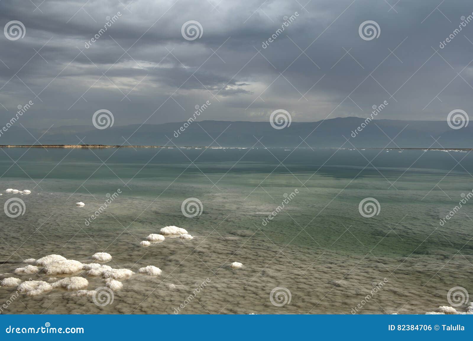 Dead Sea in cloudy weather stock photo. Image of summer - 82384706
