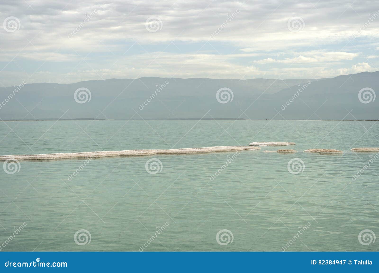 Dead Sea in cloudy weather stock image. Image of rocks - 82384947