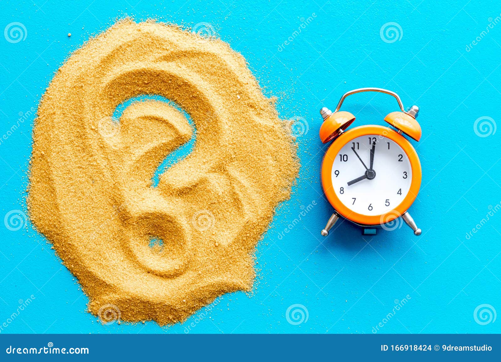 Deadline Concept. Clock Near Question Mark on Sand on Blue Background ...