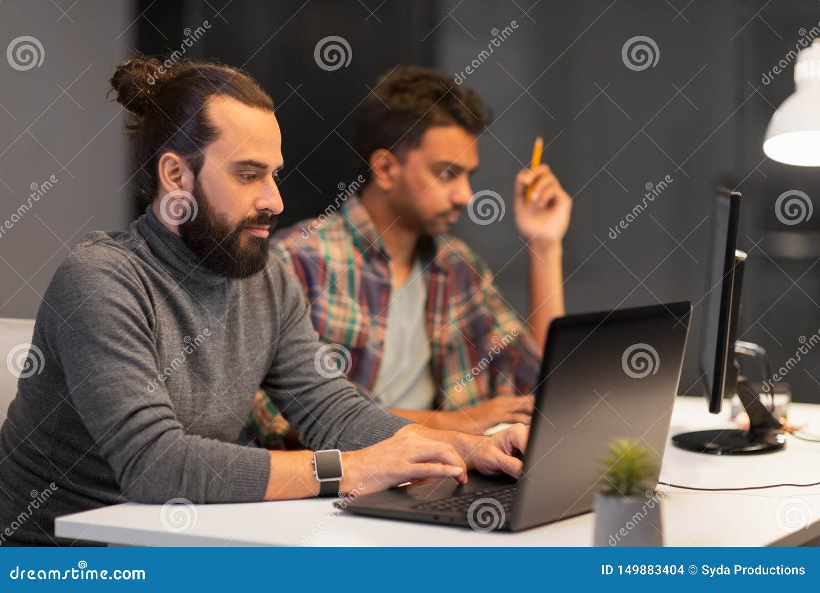 Creative Team with Computer Working Late at Office Stock Photo - Image ...