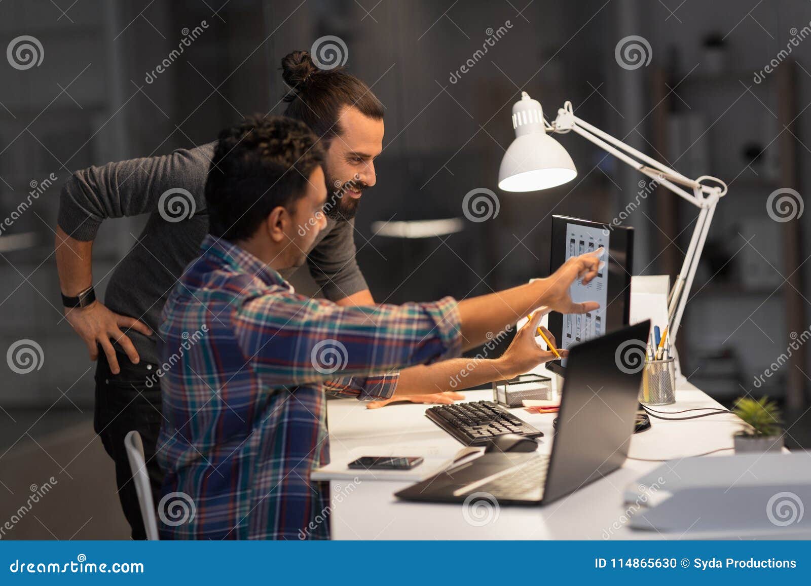 Creative Team with Computer Working Late at Office Stock Photo - Image ...