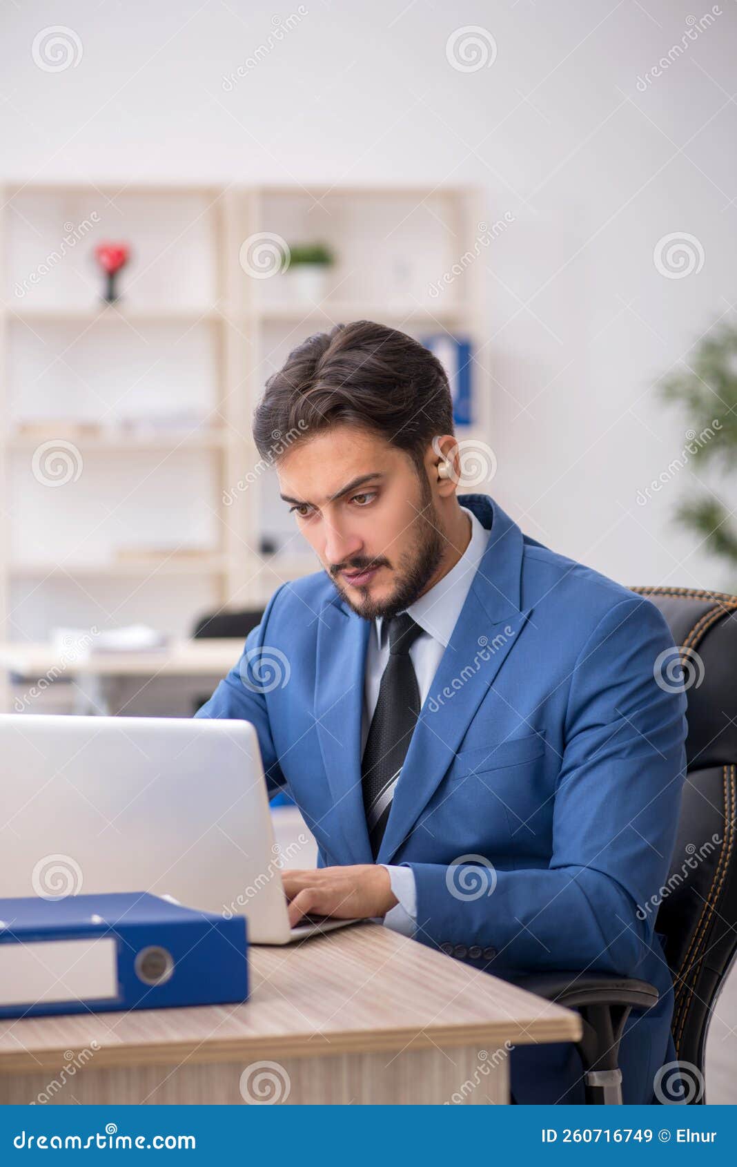Deaf Male Employee Using Hearing Aid at Workplace Stock Image - Image ...