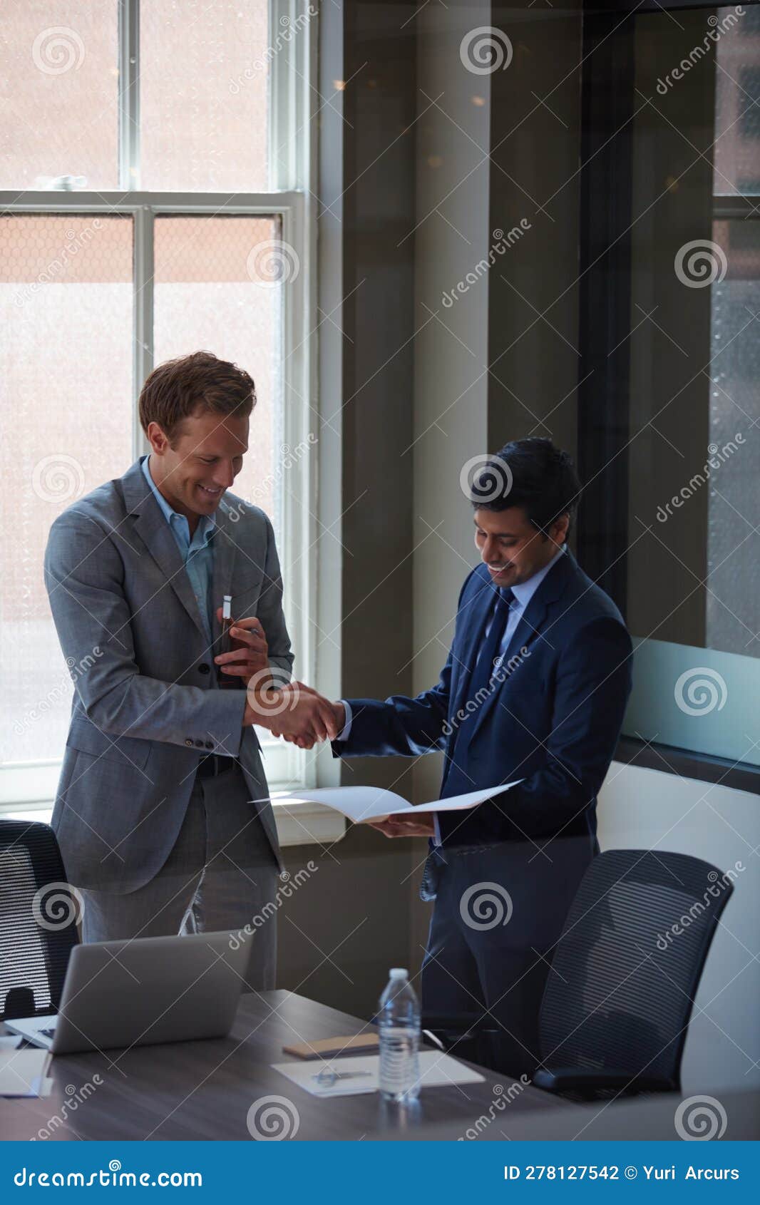 The Deal is Done. Two Businessmen Shaking Hands in the Office. Stock ...