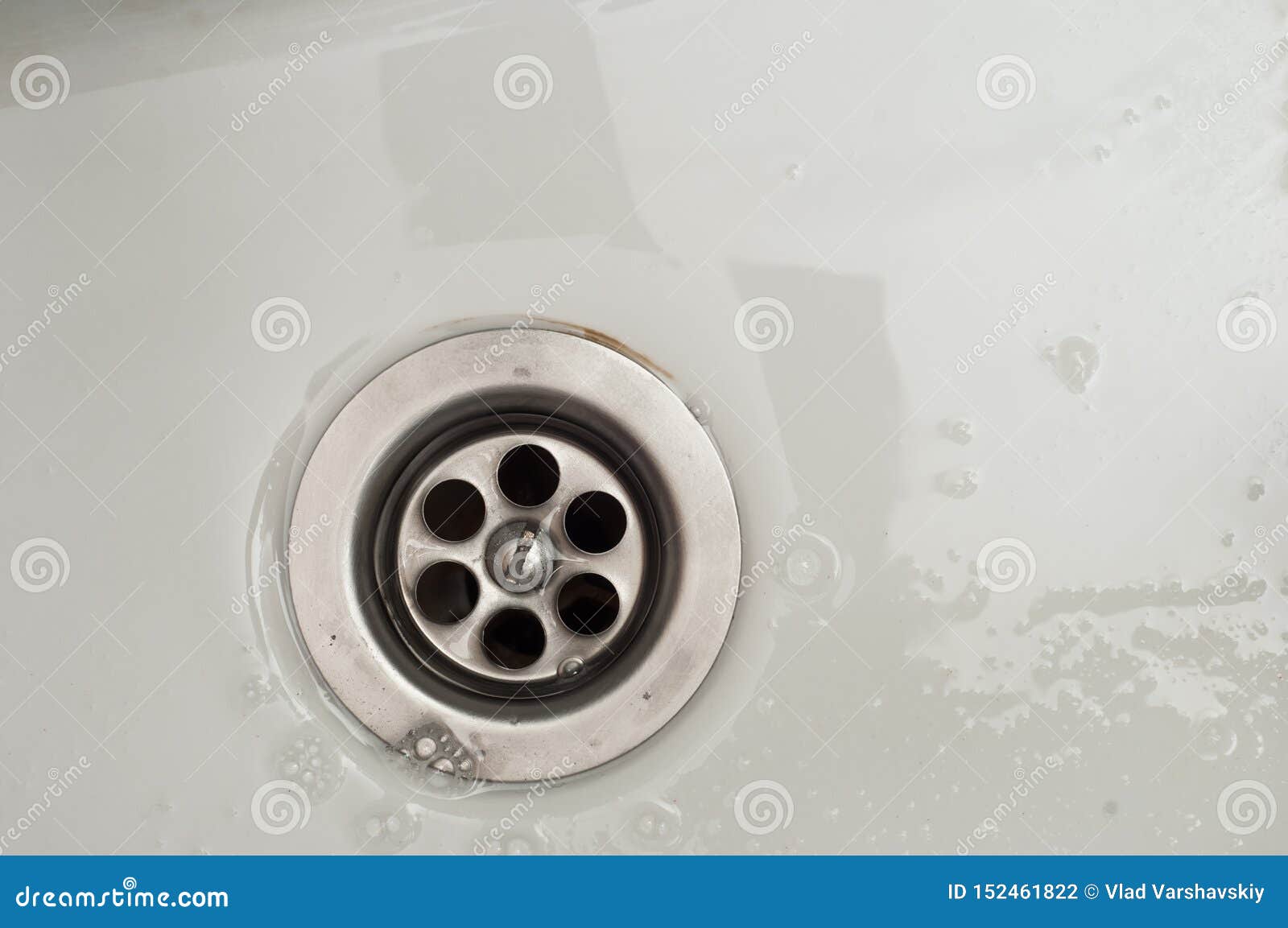 Debris-free Net for Draining Water from a White Ceramic Sink Stock ...