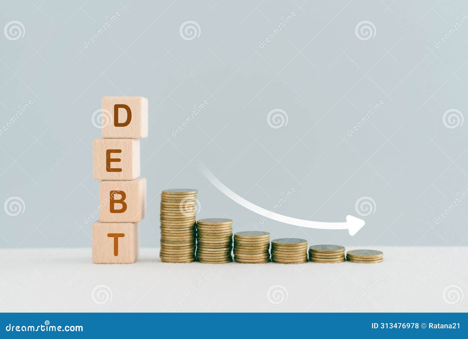 DEBT Word on Wooden Cube Blocks Word and Down Arrow with Stack of Coin ...