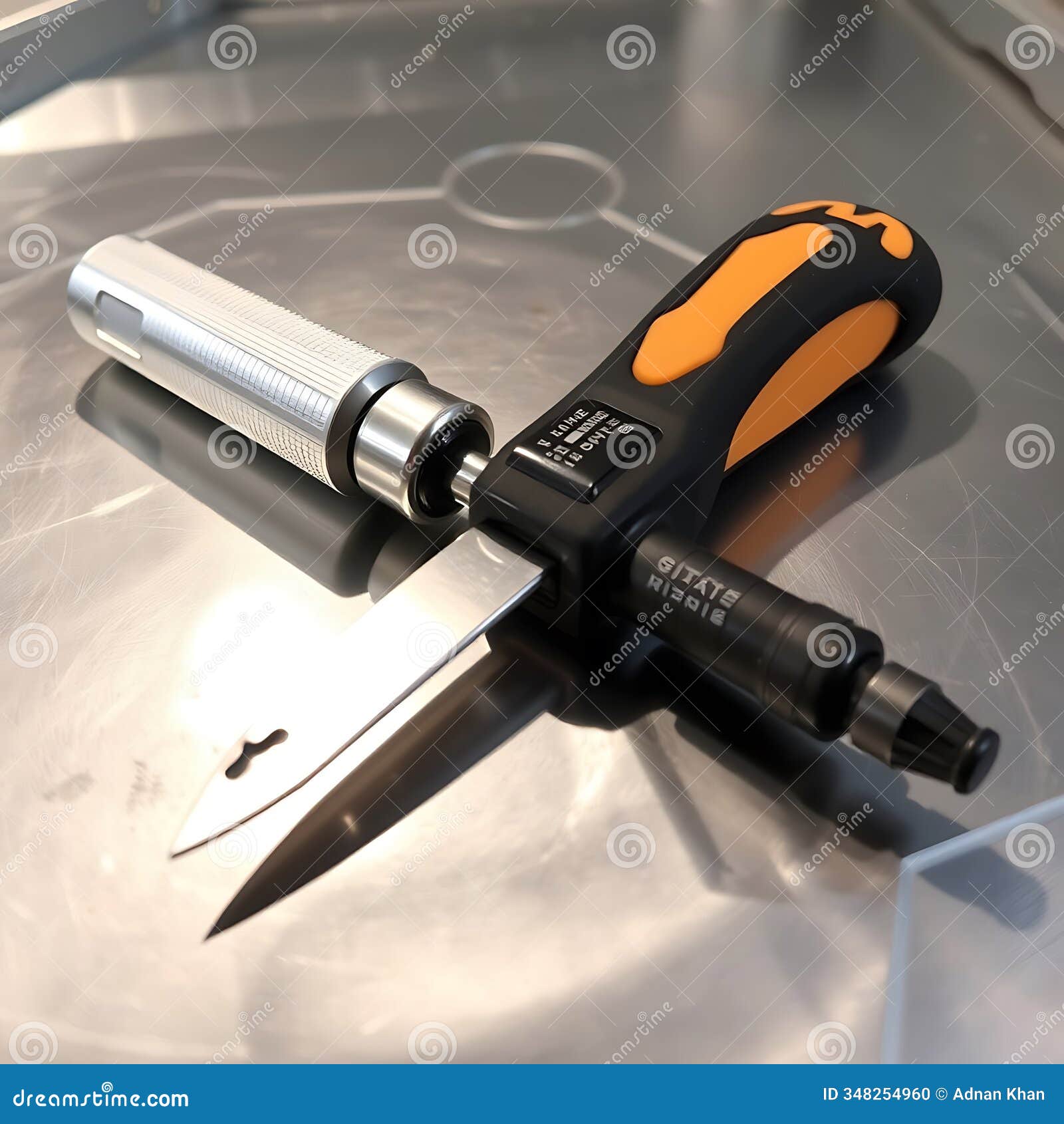 Deburring Tool Resting on a Metal Sheet with a Light Reflection ...