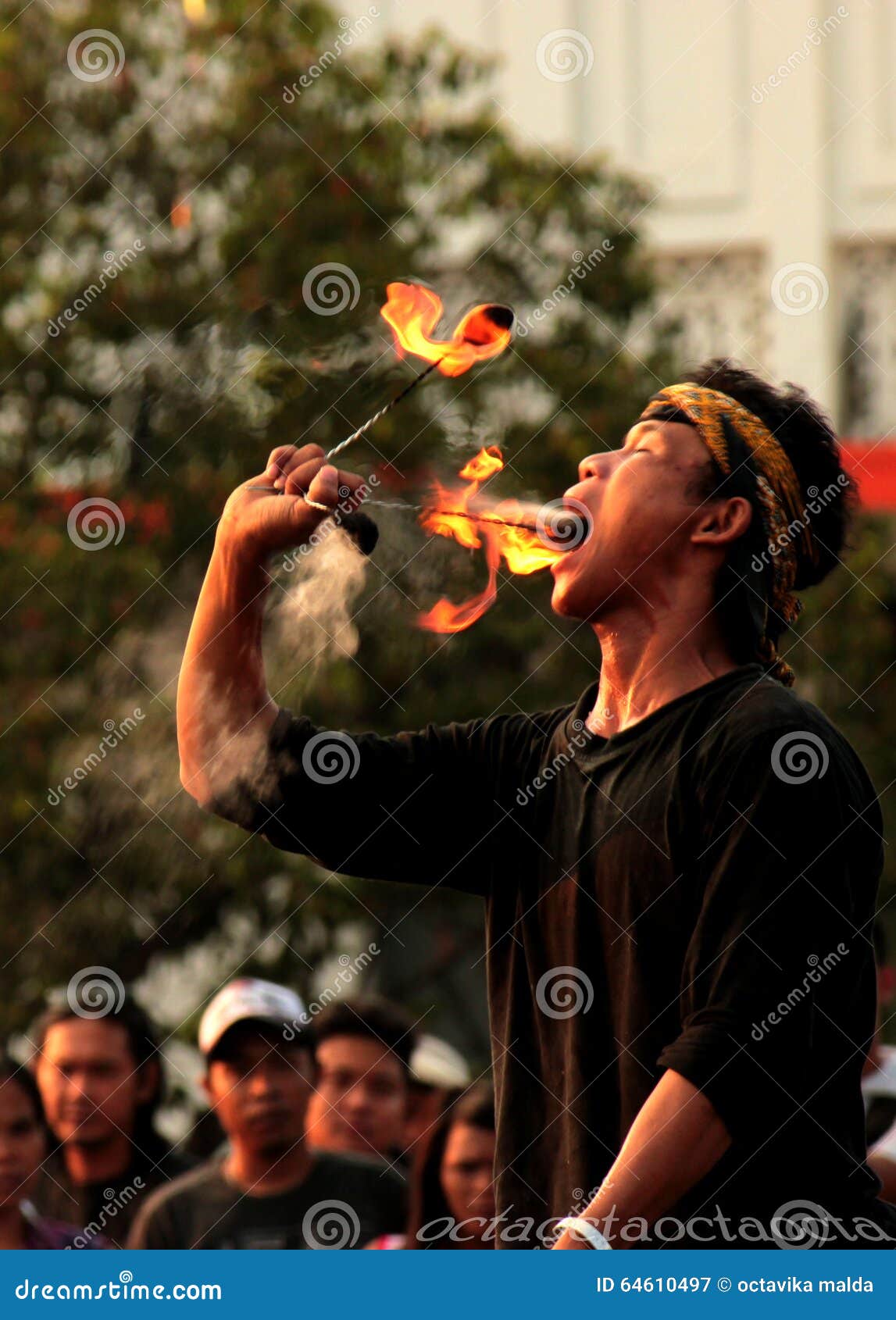 Debus eating fire editorial photography. Image of people - 64610497