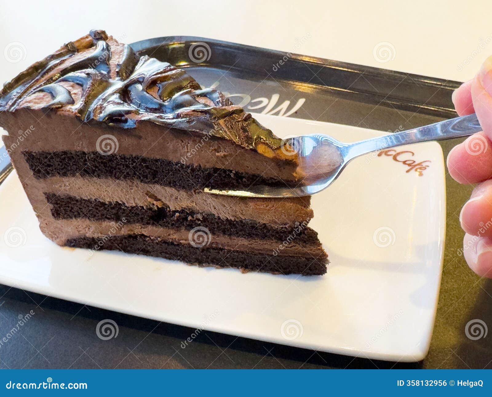 Decadent Chocolate Cake Slice on a White Plate in a Cafe Setting, Mc ...