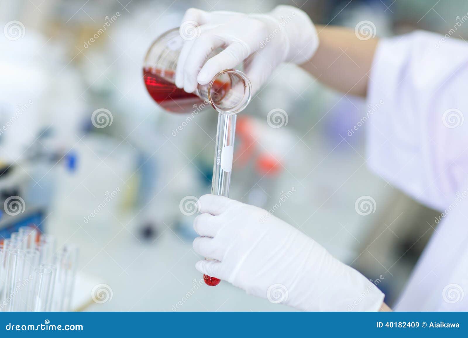 Decanting a Violet Liquid into a Graduated Cylinder Stock Image - Image ...