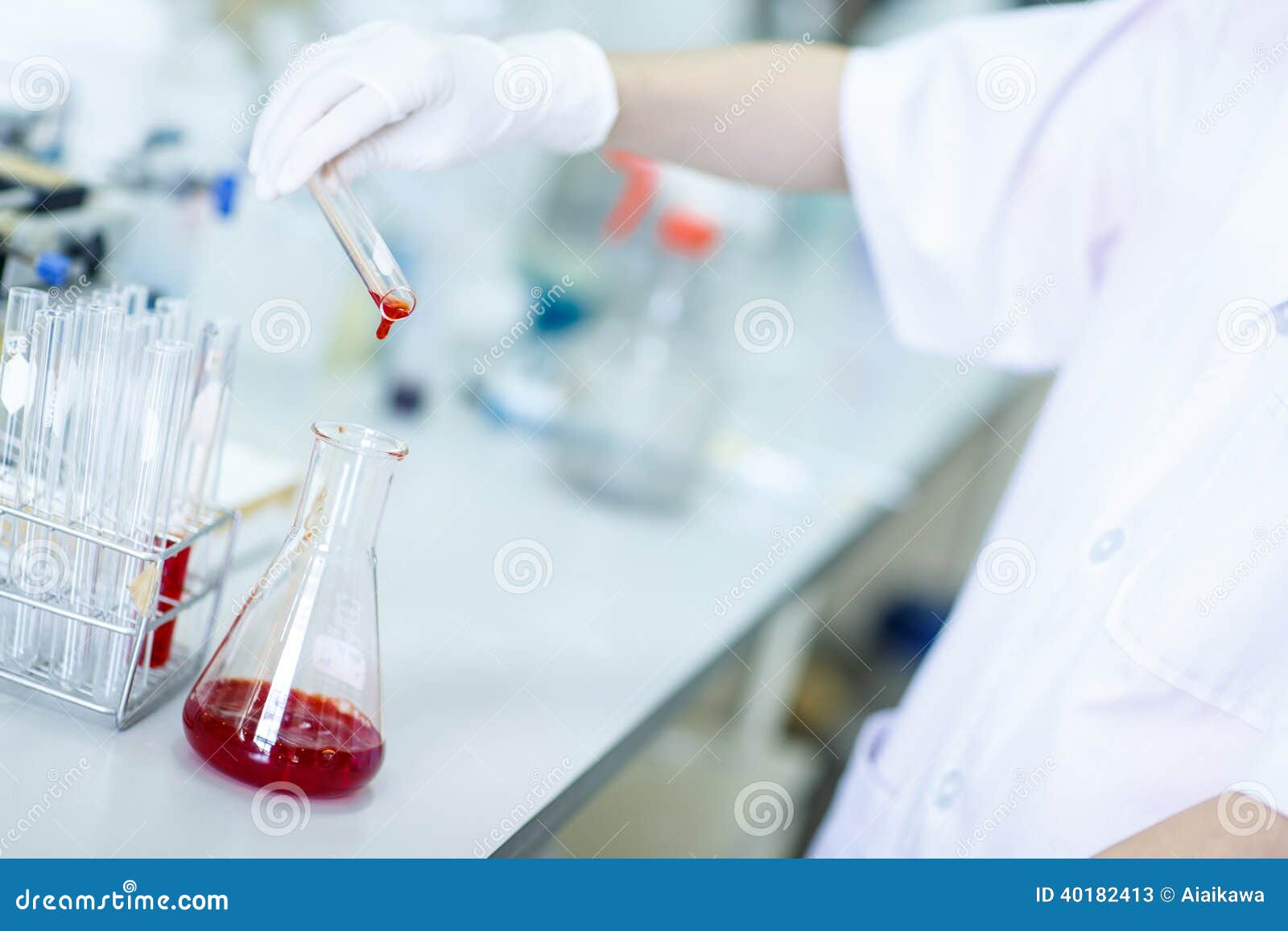 Decanting a Violet Liquid into a Graduated Cylinder Stock Image - Image ...