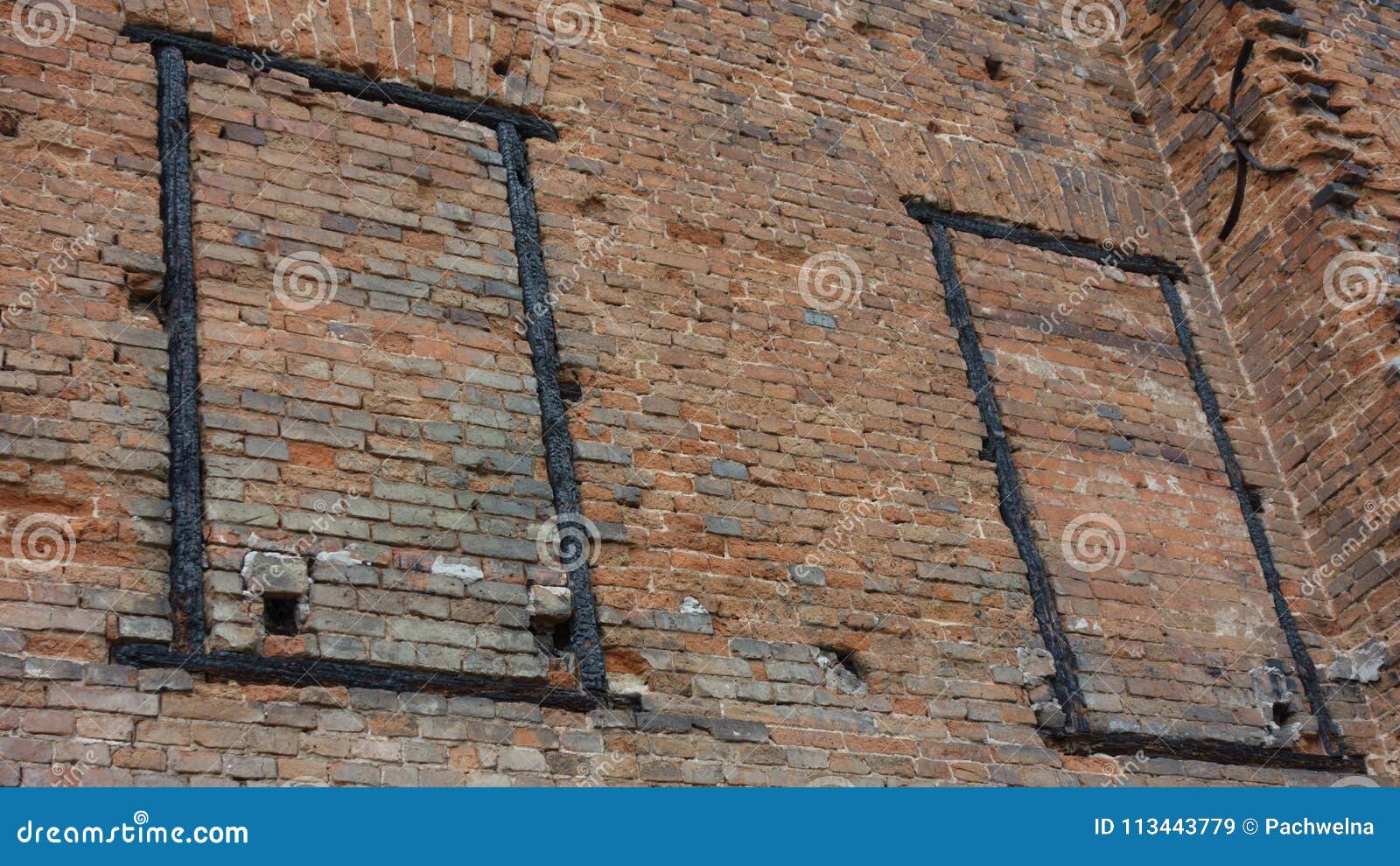 Dilapidated Brick Wall with Two Burned Out Window Frames Stock Image ...