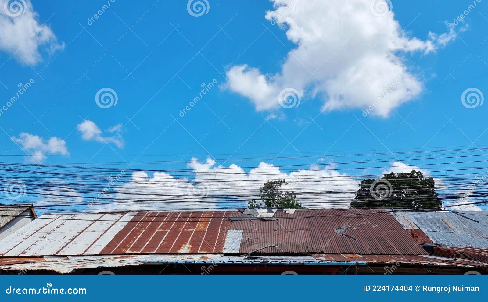 The Decayed Old Roof Cuts the Backdrop into a Beautiful Blue Sky. Stock ...