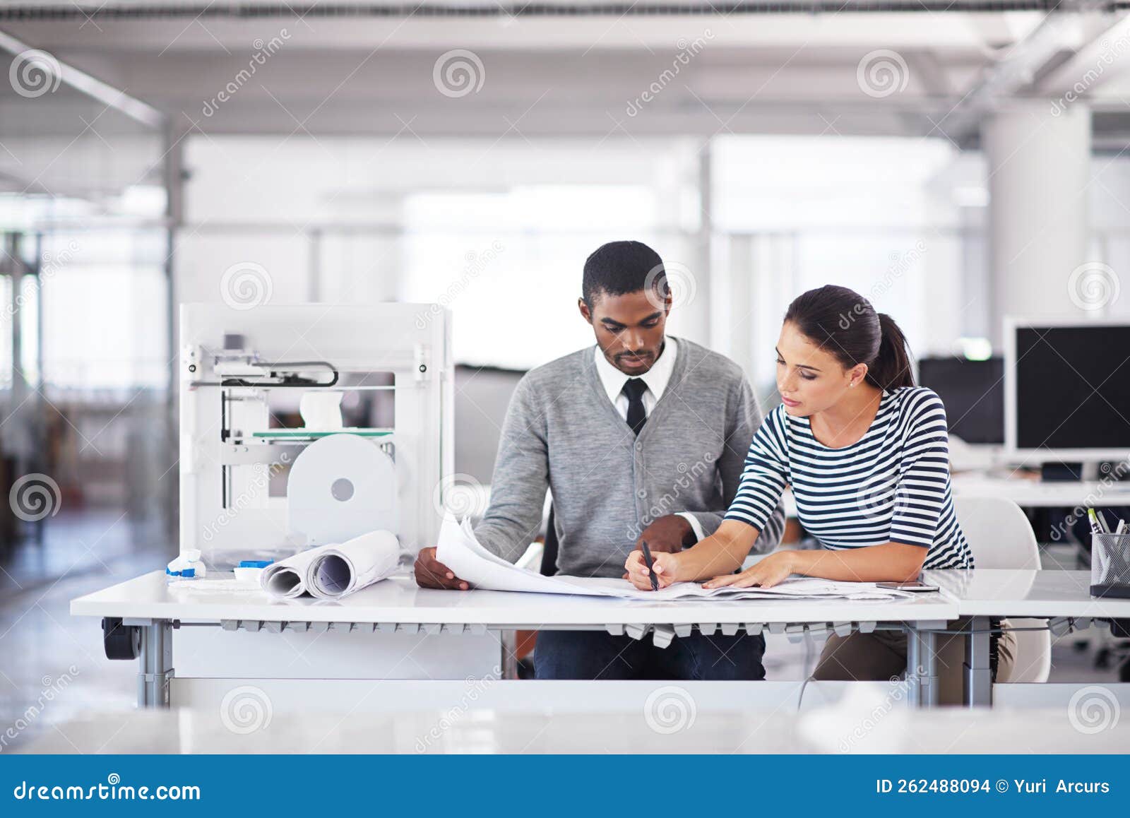 Deciding on the Perfect New Design. Two Colleagues Talking Together ...