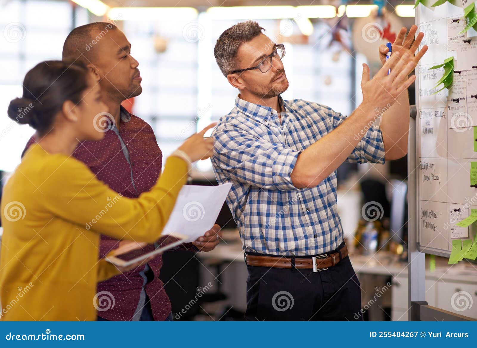 Deciding on a Plan of Action for Their New Project. a Group of ...