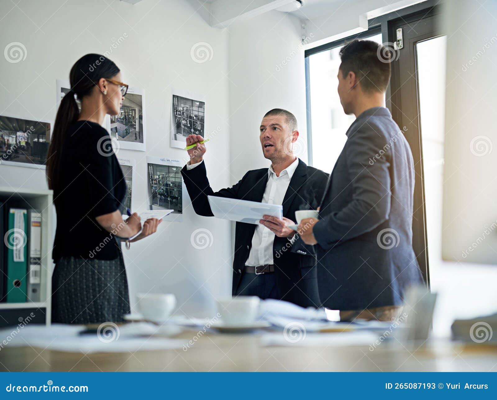 Deciding on a Strategy. Three Colleagues Working in the Office. Stock ...