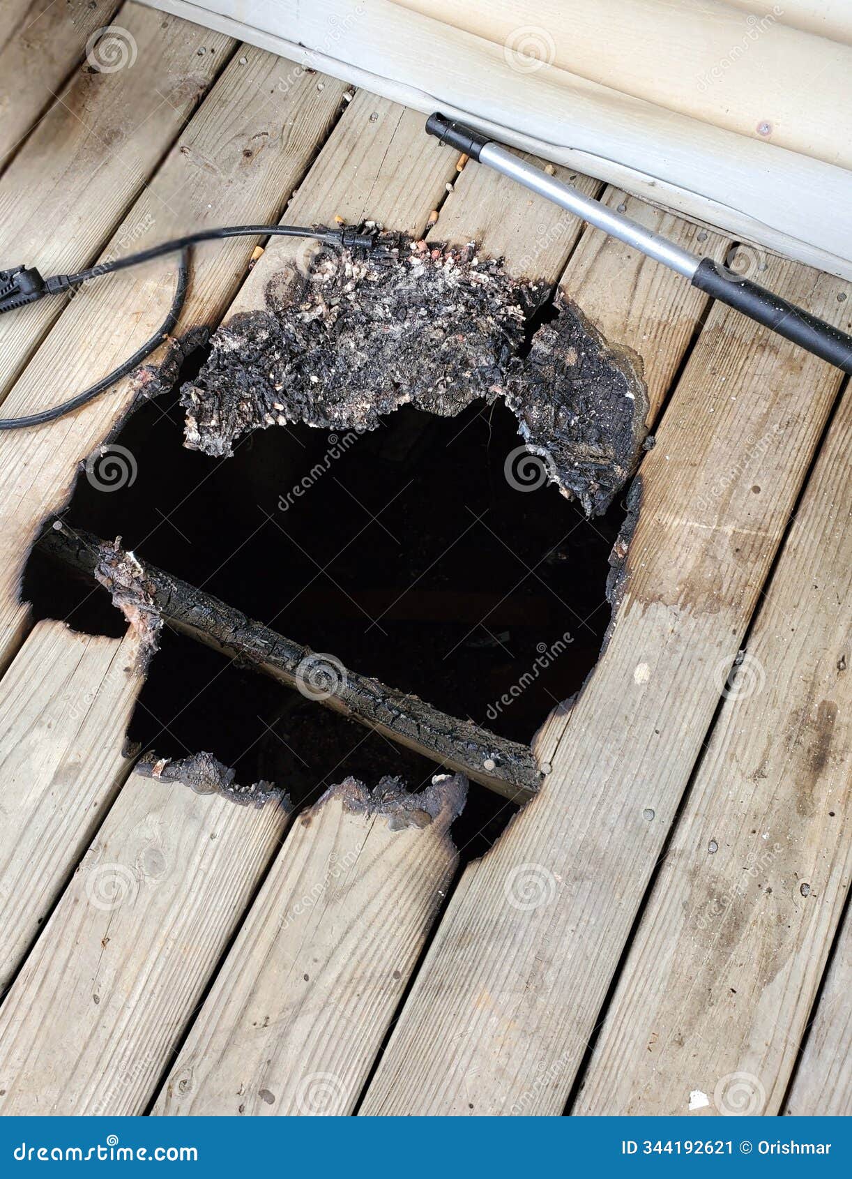 Deck hole fire damage stock image. Image of hole, siding - 344192621