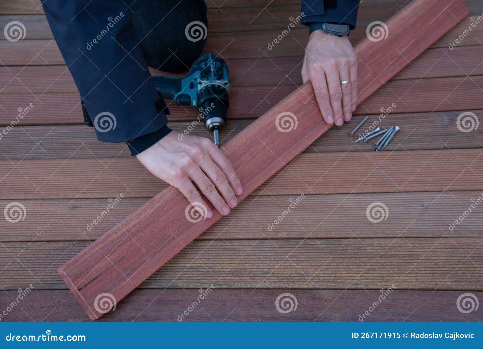 Deck Installation Carpenter Hands Holding Ipe Board Stock Image - Image ...