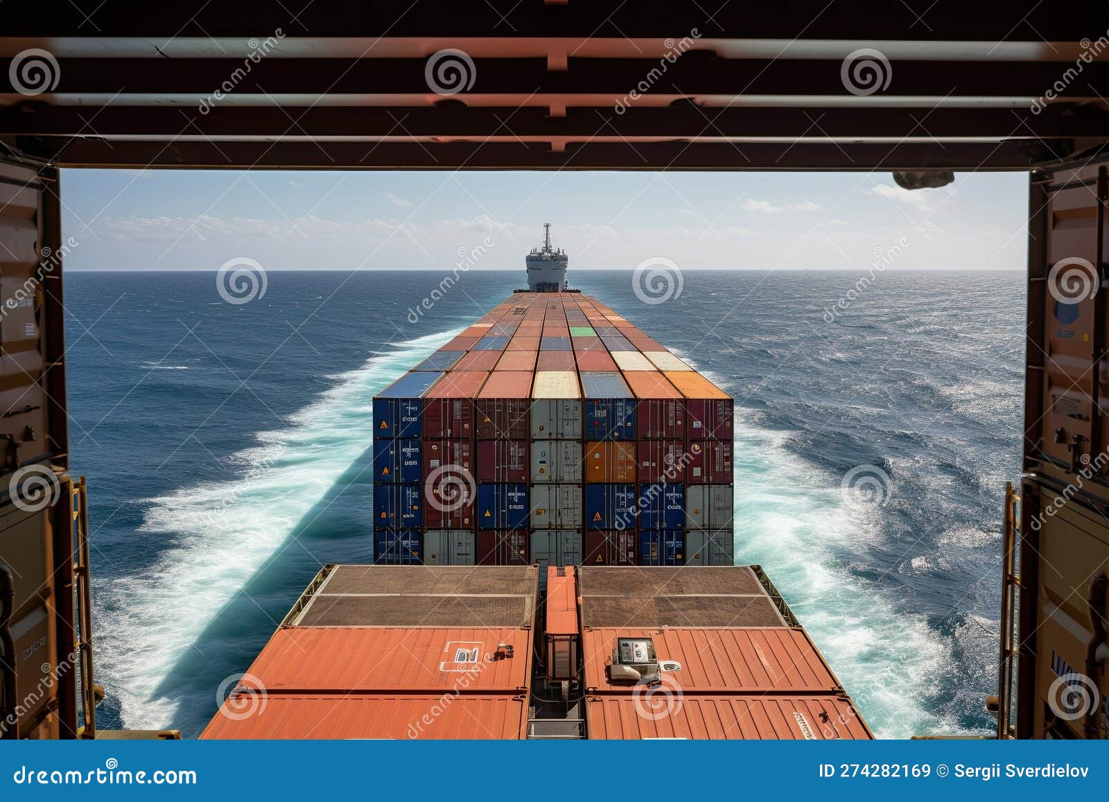 The Deck Of A Massive Container Ship Is Shown, With Rows Of Stacked ...