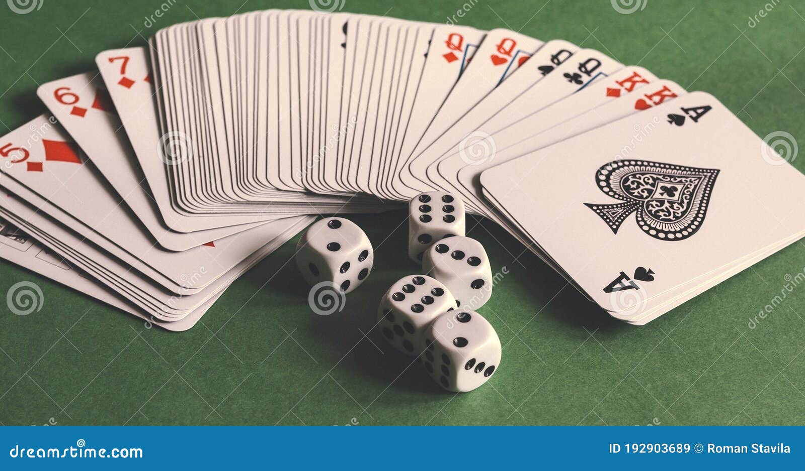 A Deck of Playing Cards and Dice on a Green Table Stock Image - Image ...