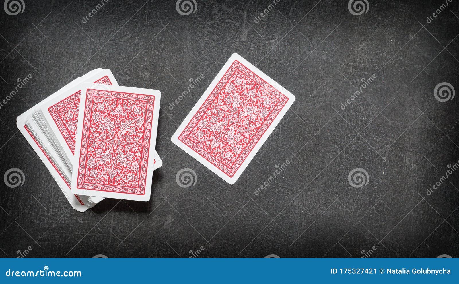 Deck of Playing Cards and One Card Separately Face Down on a Black ...
