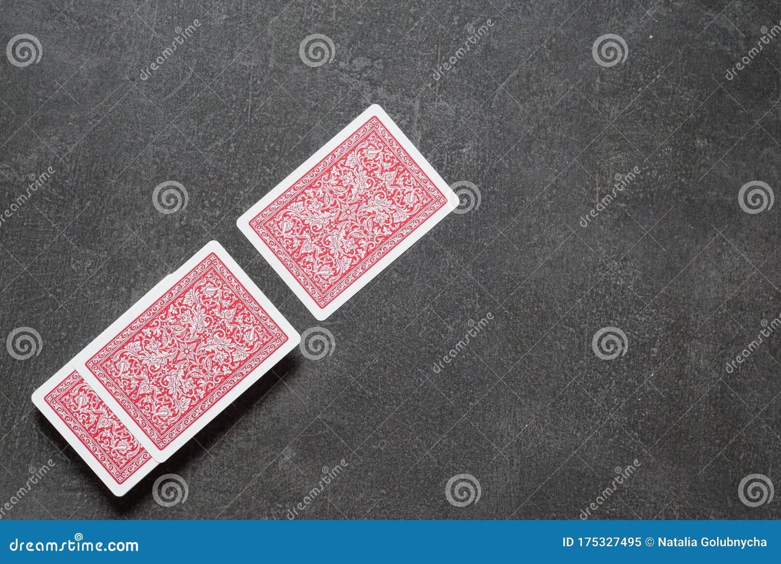 Deck of Playing Cards and One Card Separately Face Down on a Black ...