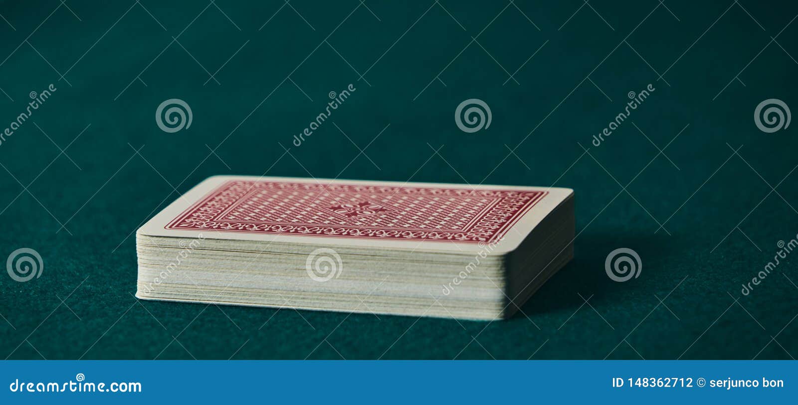 A Deck of Red Cards on the Green Game Mat Stock Photo - Image of ...