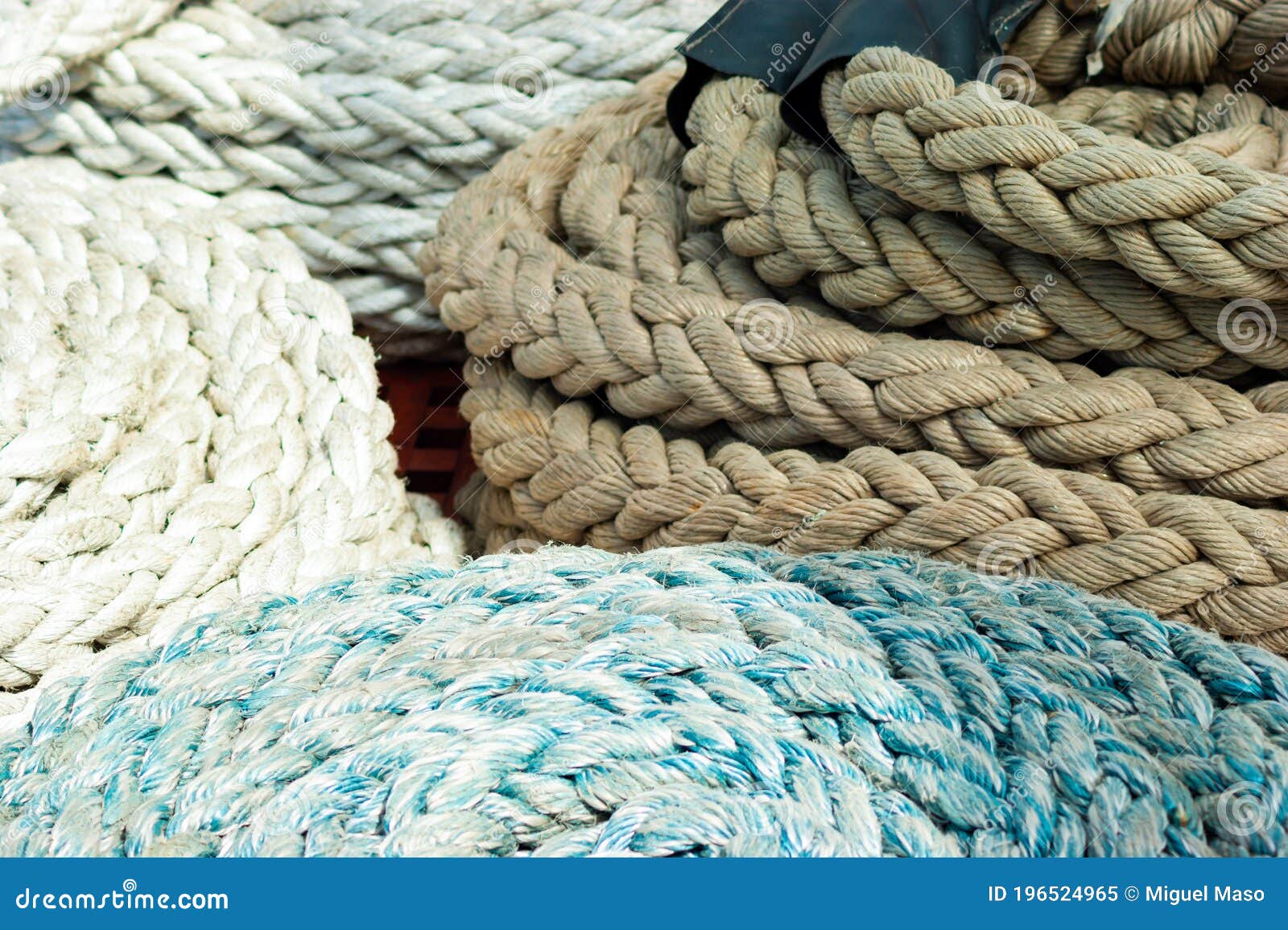 Spiral Ship Rope Lying Down On Dark Brown Deck As Background Texture ...